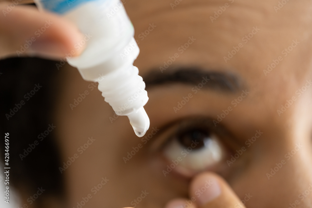 African Woman Pouring Eye Drop Medication For Glaucoma Stock Photo ...