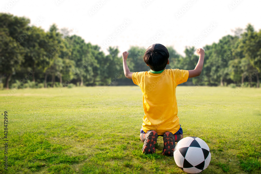 Full Length of Excited boy football player after goal scored Stock ...