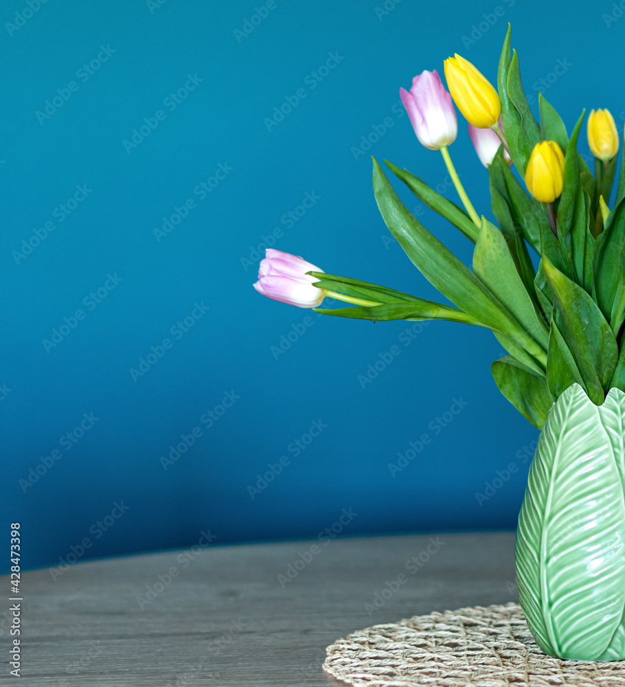 Vertical photo of pink and yellow tulips inside a green vase inside my ...