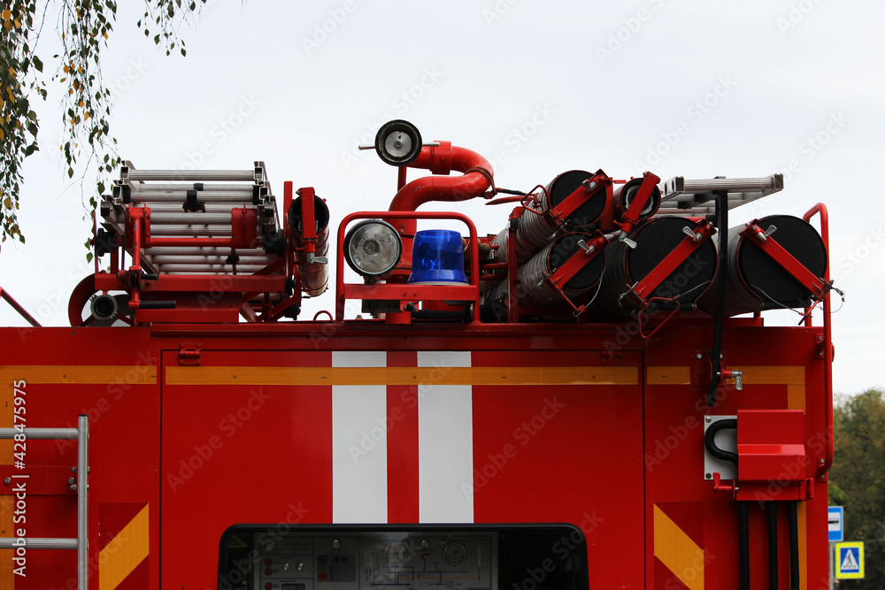 fire truck, upper part. A folding ladder is fixed on the roof, which ...
