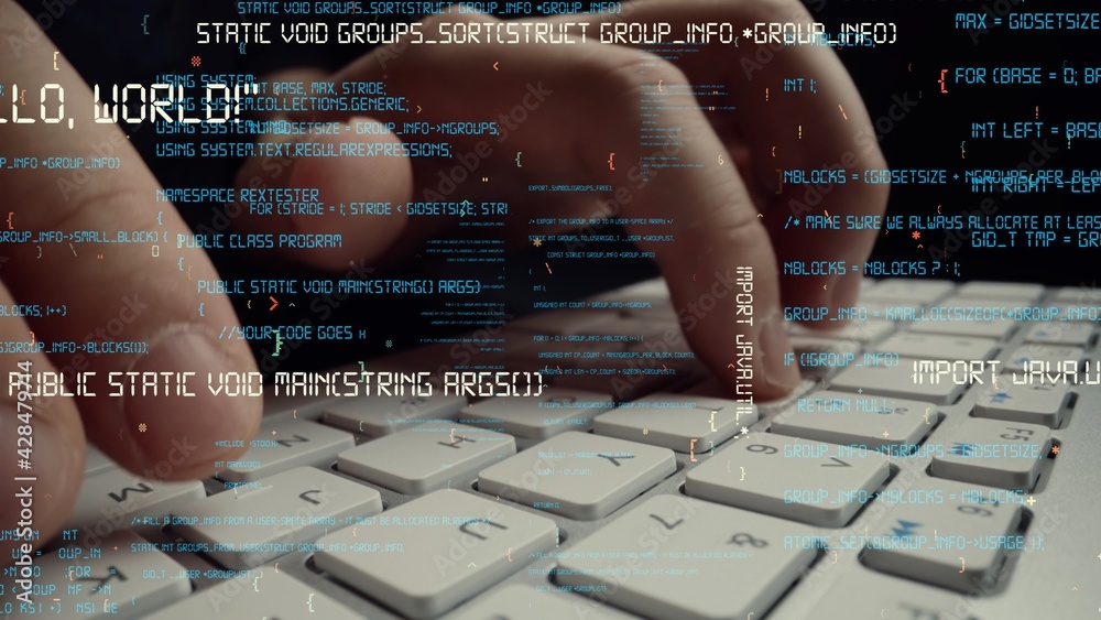 Creative visual of computer programming coding and software development shown by man working on ...