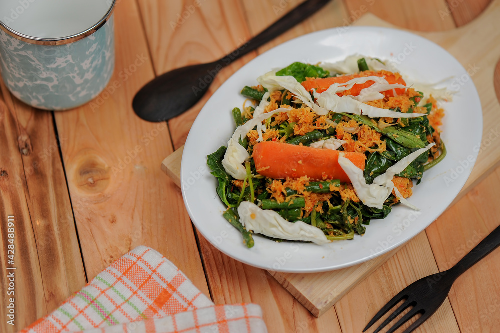 Urap (Indonesia Traditional Food). Urap is a salad dish of steamed ...