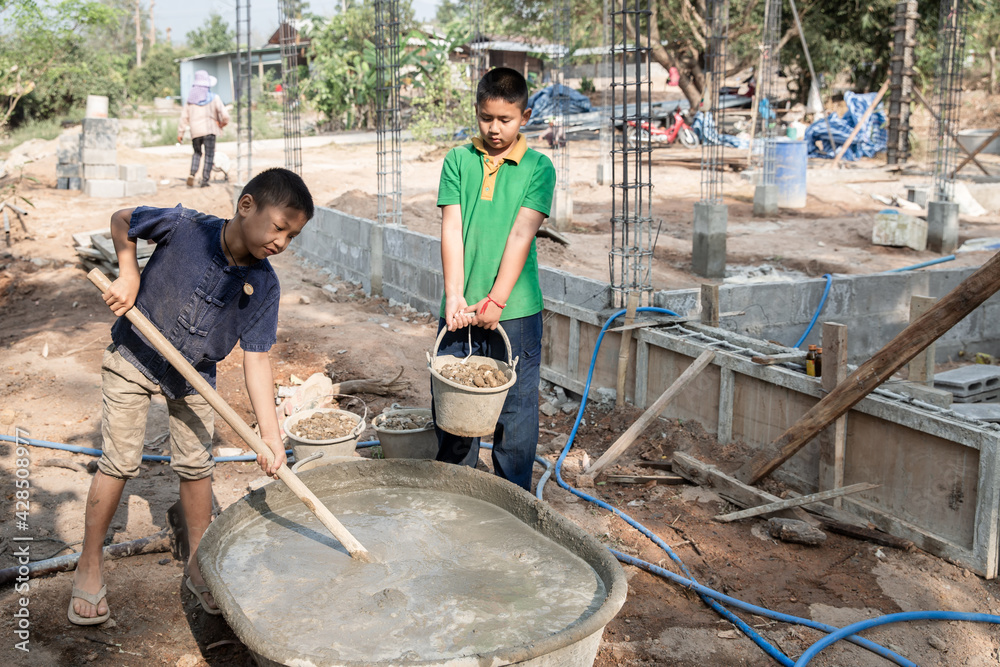 Photo Children who work hard on the construction site, child labor ...