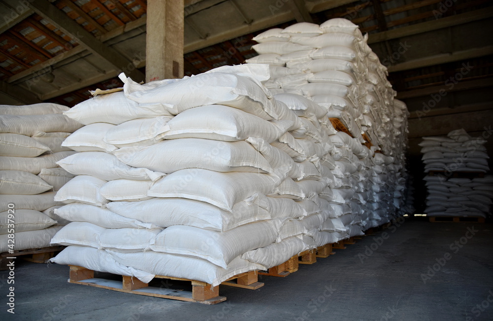 Large sacks of grain are stacked in the warehouse. Stock Photo | Adobe ...