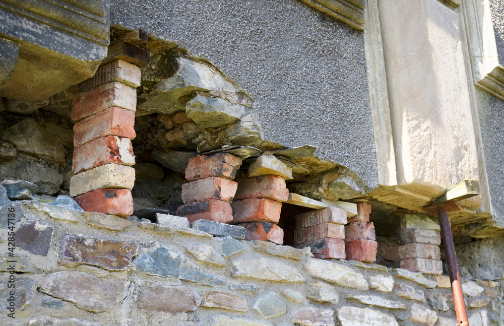 Brick brace support holding up fragile building wall Stock Photo ...