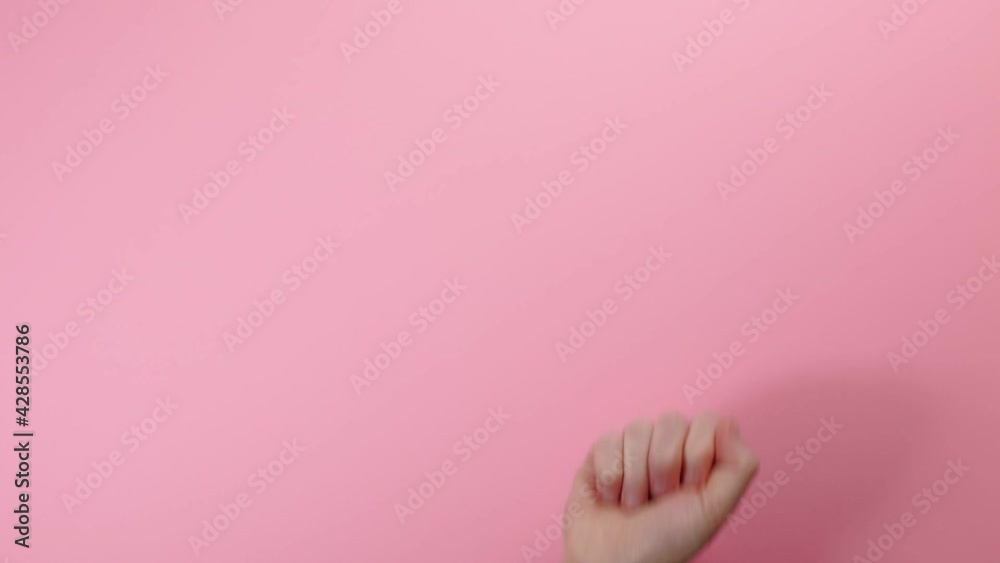 A male's hand in a shirt shows the direction of the index finger of the ...