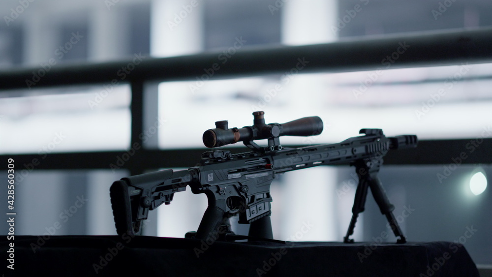 Sniper rifle with telescopic sight mounted on bipod. Rifle with optical ...