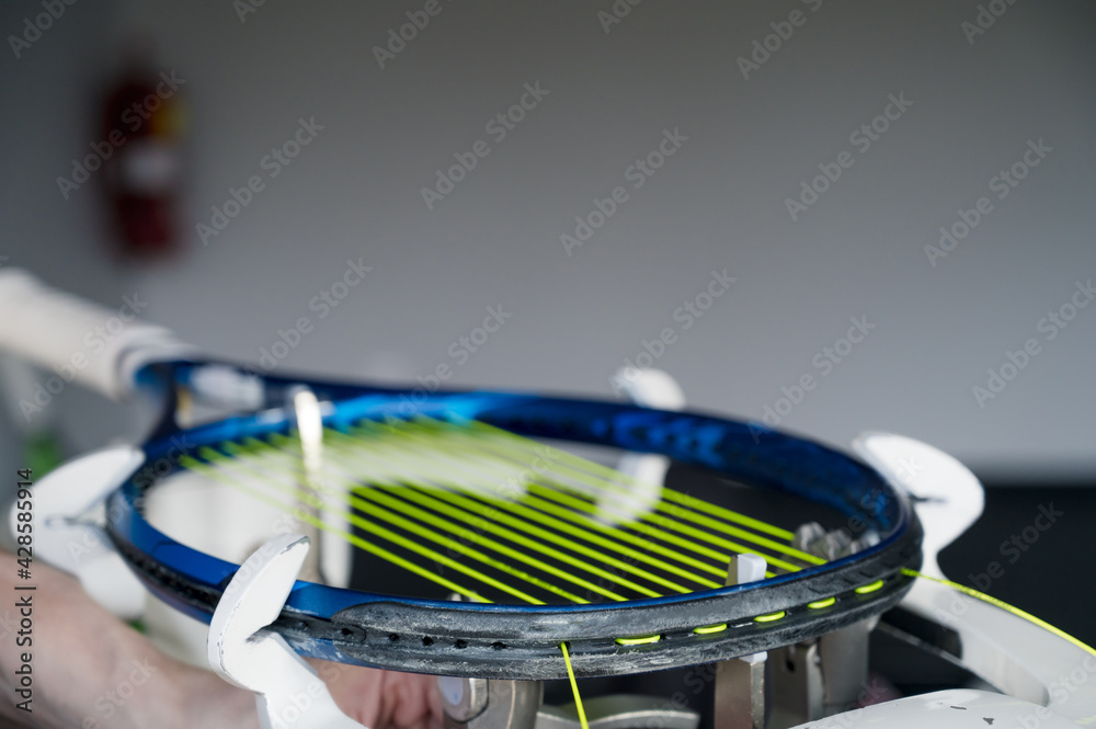 Photo Close up of tennis racket on electronic stringing machine Anastasia Posters tableaux et papiers peints Europosters