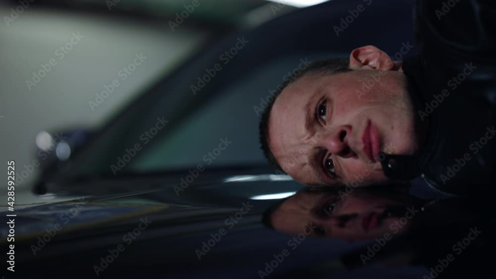 Police officer putting criminal face on car trunk. Sad man arrested by ...