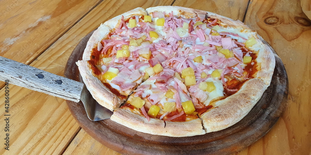 Hot plate Italian pizza topped with Pork, bacon, ham, mozzarella and ...