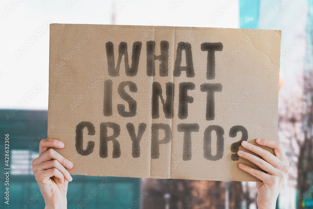 The question " What is NFT Crypto? " on a banner in men's hand with ...