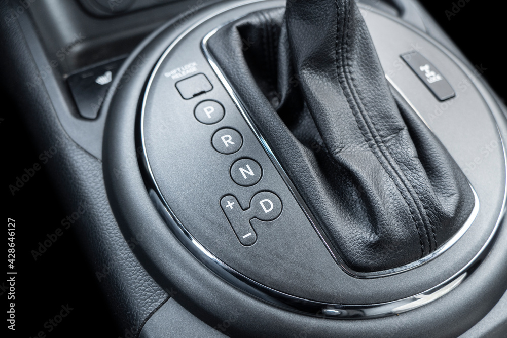 Automatic gear stick of a modern car. Modern car interior details ...
