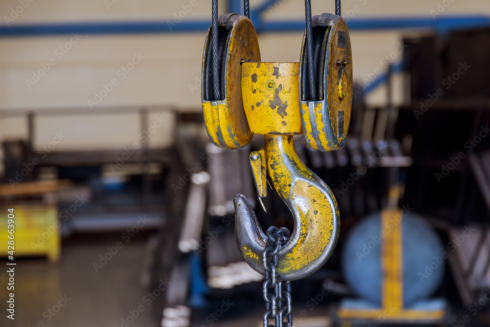 hook for industrial crane. Overhead crane hook and chain on factory ...