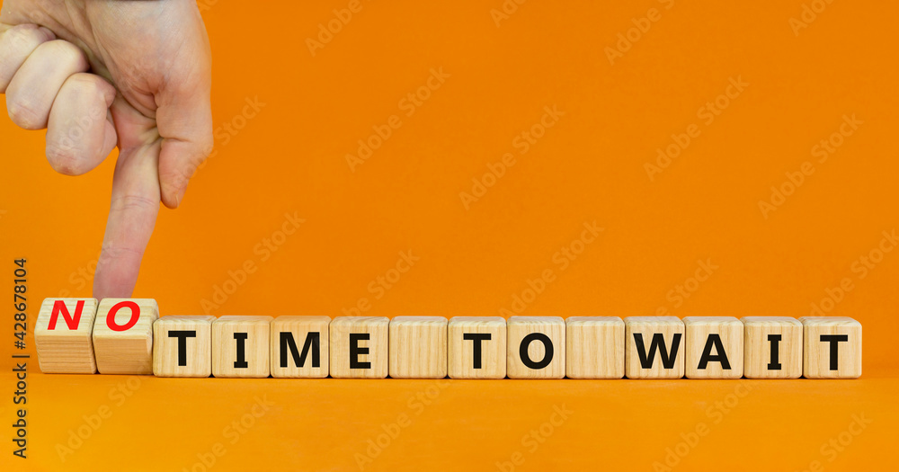 Foto de No time to wait symbol. Businessman turns wooden cubes and ...