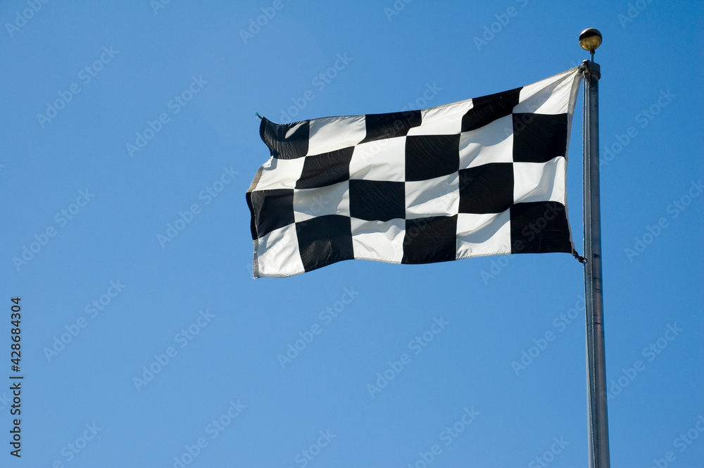 Checkered Finish Line Flag on Pole Stock Photo | Adobe Stock