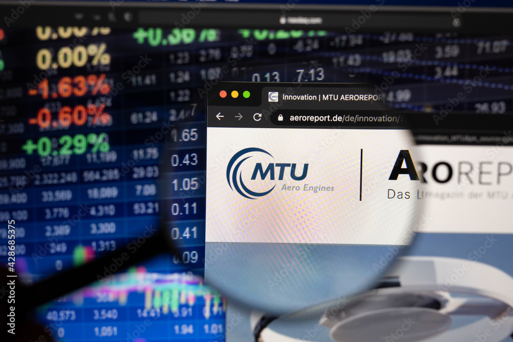 MTU Aero Engines AG company logo on a website with blurry stock market ...