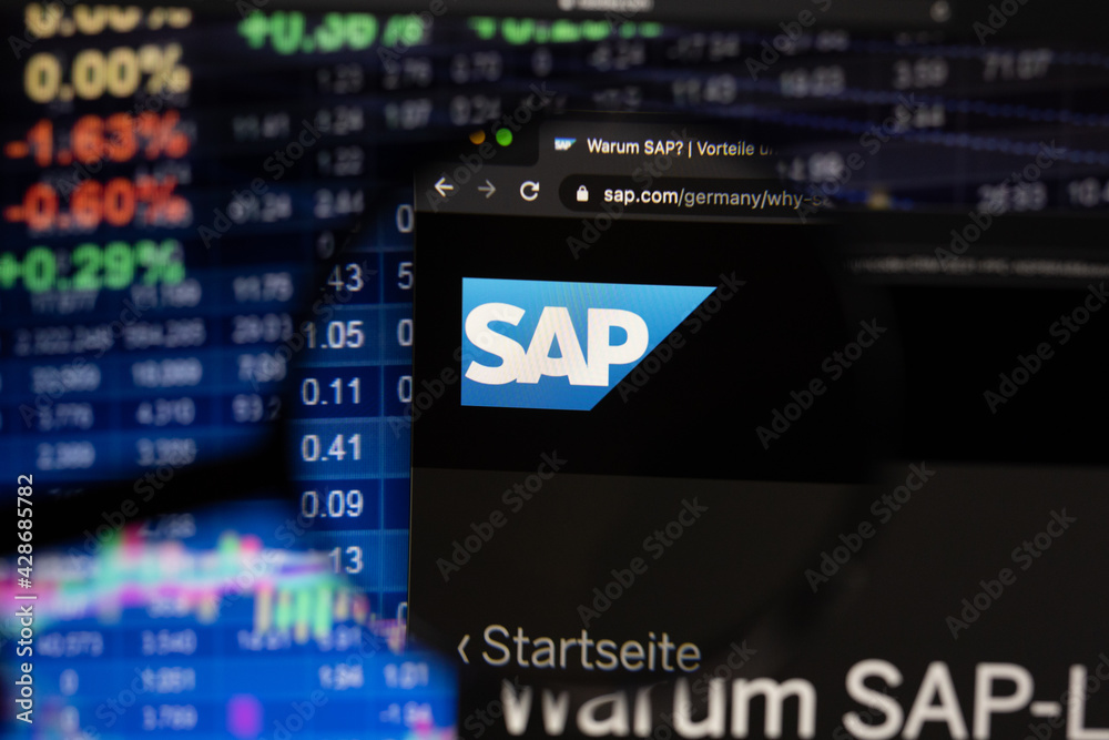 SAP company logo on a website with blurry stock market developments in ...