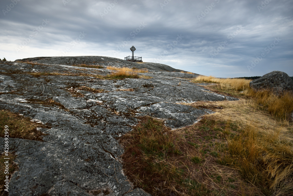 Ansgars Cross on the rocky shore of Birka, Björkö island, lake Mälaren ...