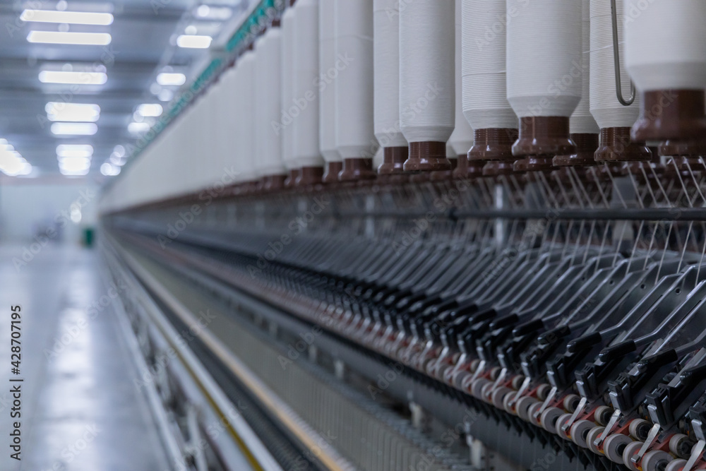 Cotton Yarns in the cotton thread factory where they are rolled into ...