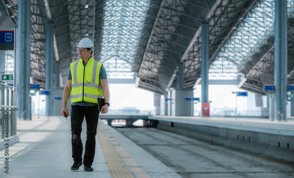 Engineer railway under inspection and checking construction process ...