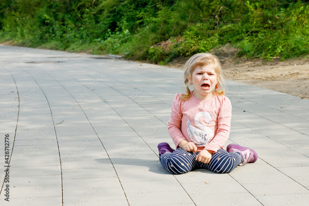 Cute upset unhappy toddler girl crying. Angry emotional child shouting ...