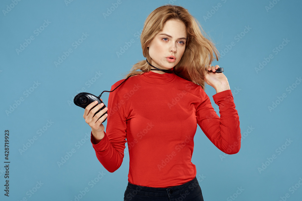 Pretty woman in red sweater joystick controller set-top box blue ...
