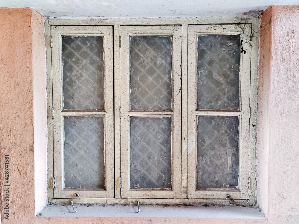 Stock photo old dusty and dirty window of a house with cream color ...