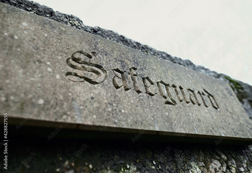 Carved stone old english and german type on A brutalist cold gritty ...