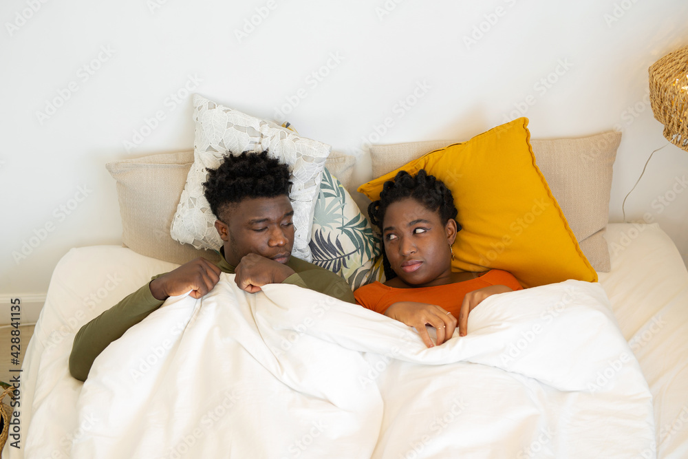 beautiful young african couple sleeping under a blanket Stock Photo ...