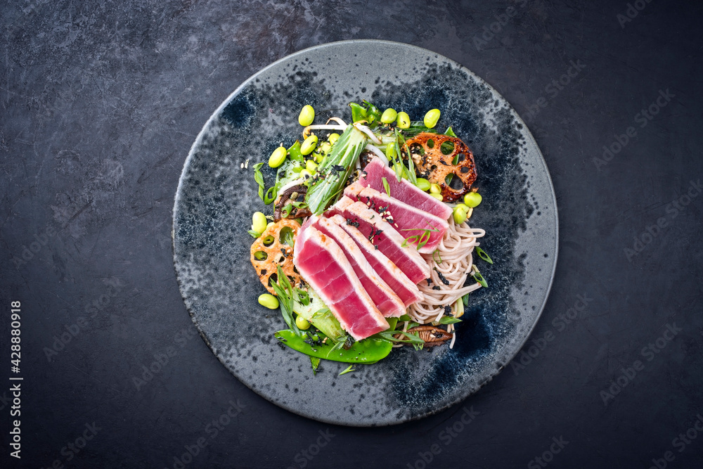 Modern style traditional Japanese gourmet seared tuna fish steak tataki ...