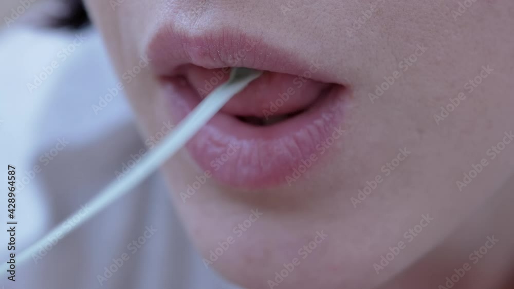 Woman Chews Chewing Gum Stretches it in Length with Fingers. Prevention ...
