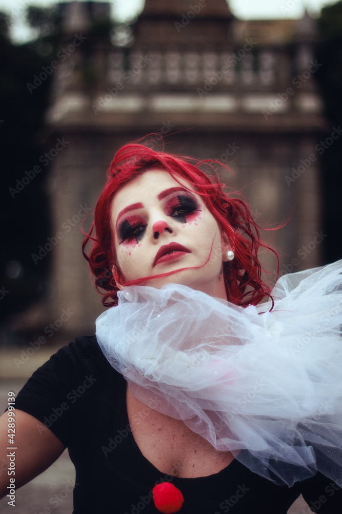 Beautiful young woman dressed as a clown, Beautiful girl dressed as a ...