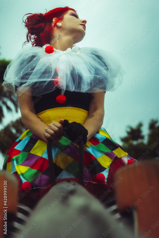 Beautiful young woman dressed as a clown, Beautiful girl dressed as a ...