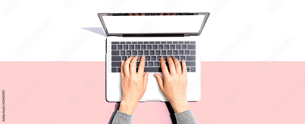Person using a laptop computer Stock Photo | Adobe Stock