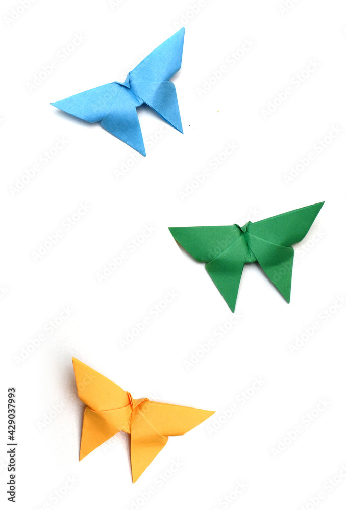 origami butterflies flying on withe Stock Photo | Adobe Stock