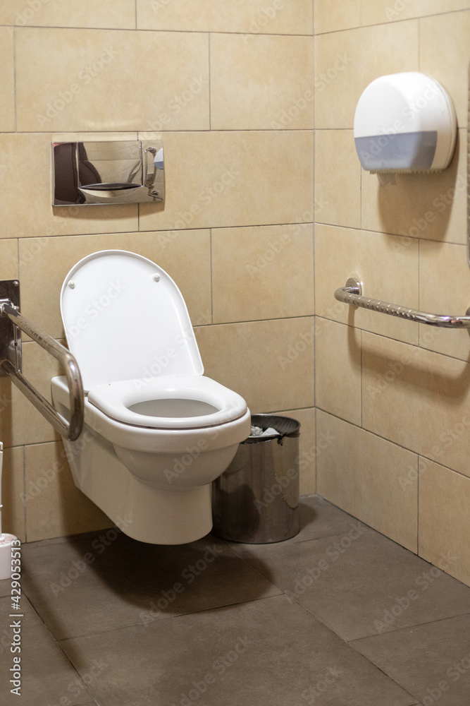 Toilet room with devices for people with disabilities. Public wc for ...