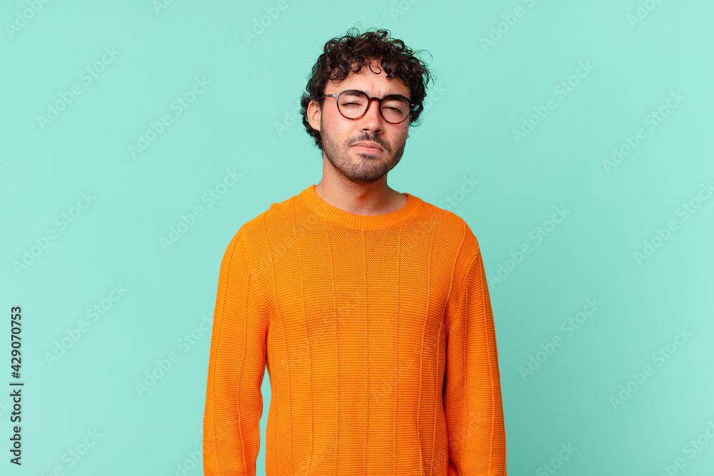 hispanic handsome man feeling sad and whiney with an unhappy look ...
