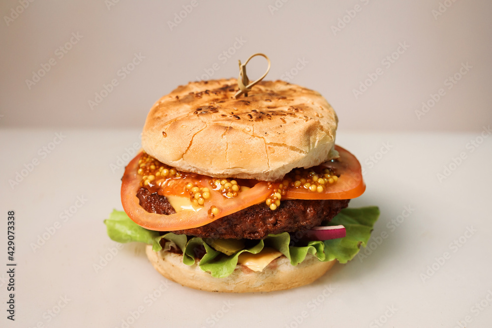 Delicious large burger on the white background, fast food concept ...