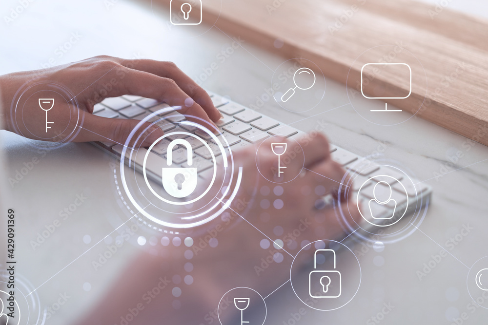 A woman programmer is typing a code on computer to protect a cyber ...