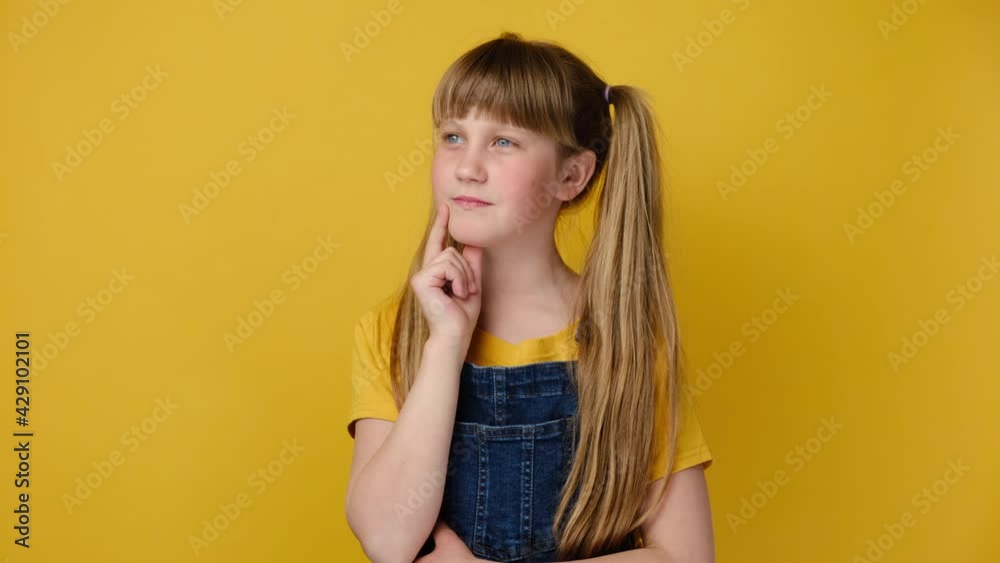 Serious little girl kid with smirk face ponders on decision, isolated ...