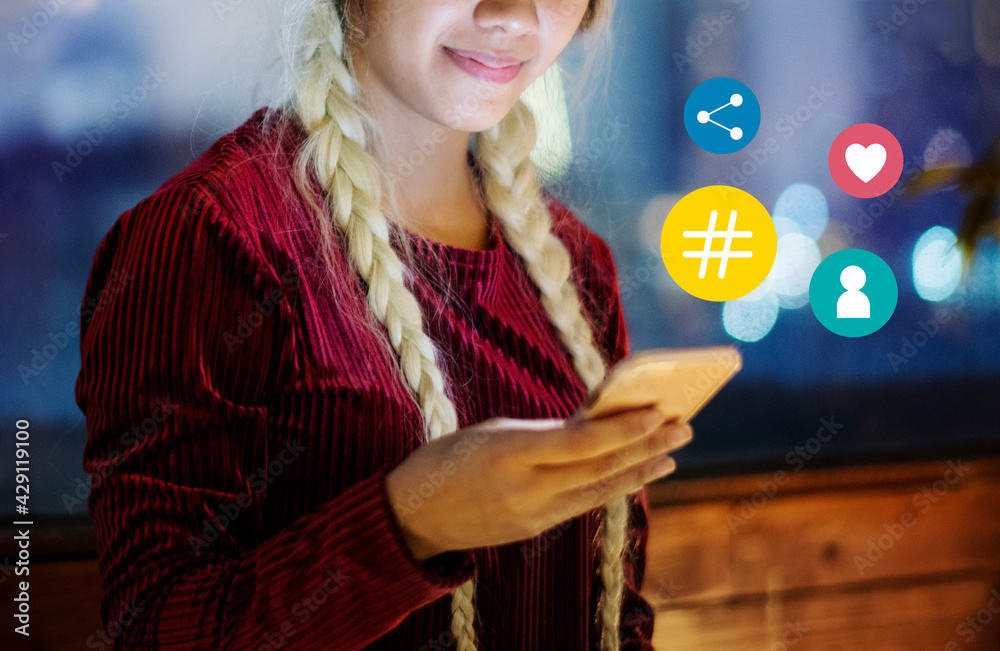 Girl posting on social media Stock Photo | Adobe Stock