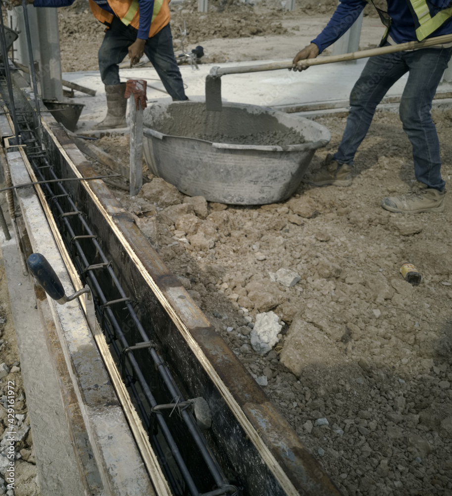 Mixer operator is work for ground beams, workman is footing work, photo ...