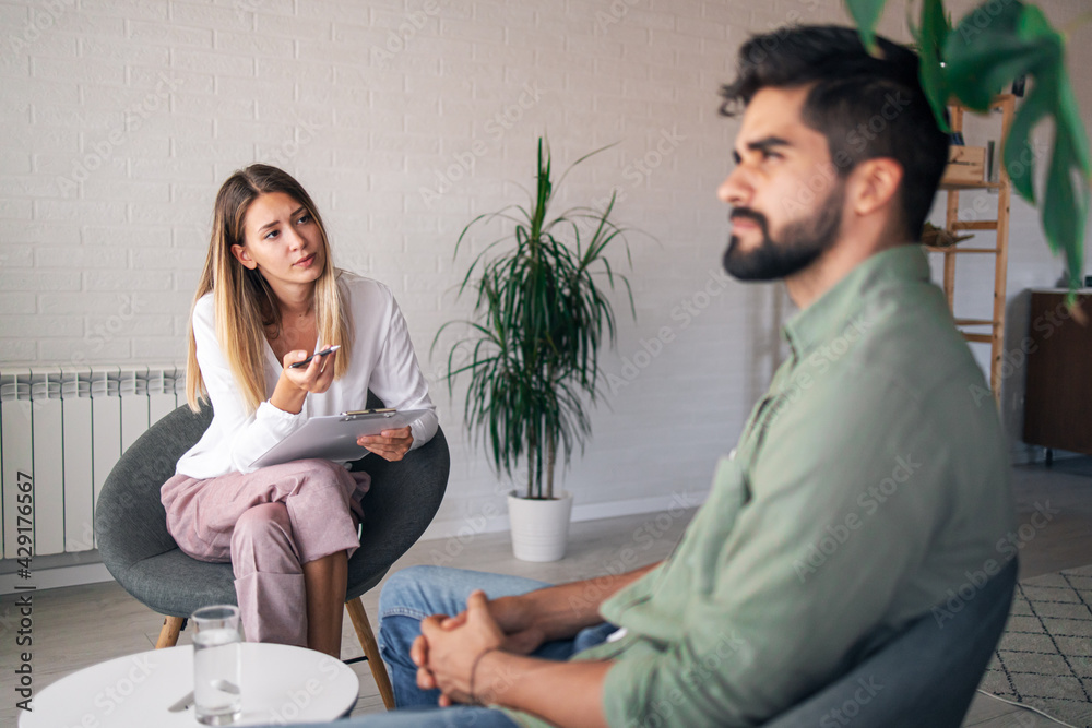 Professional handsome psychologist trying to help her patient Stock ...