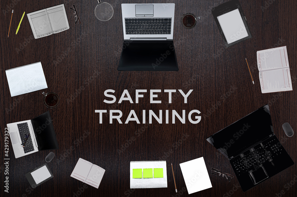 Safety training concept. Top layout of drawings of laptops, notepads ...