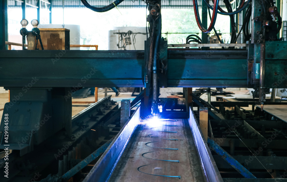 Drilling steel structure with sparks fly from drilling machine in ...
