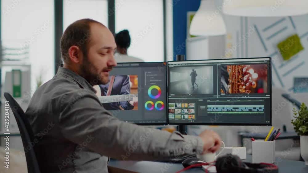 Video maker editing movie using post production software working in ...