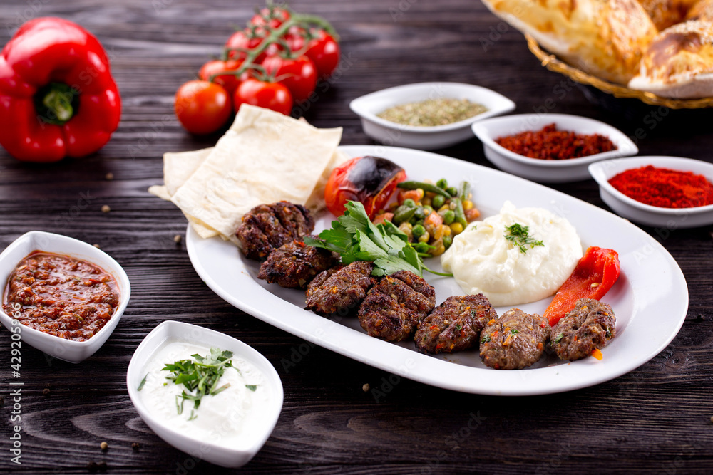 Assorted Middle Eastern and arabic dishes on a dark rustic background ...