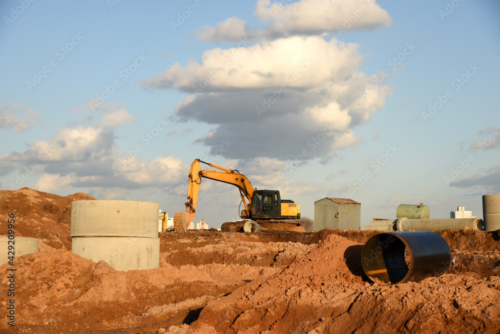 Excavator dig the trenches at a construction site. Trench for laying ...
