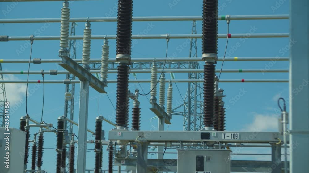 Electrical substation - grid of high voltage power lines and wires ...