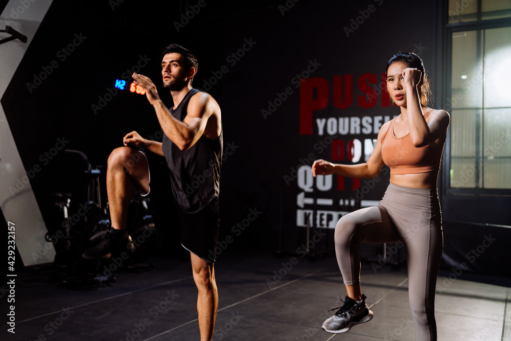 Sporty Couple Cardio Exercise Burning Calorie HIIT and Squat in Fitness ...